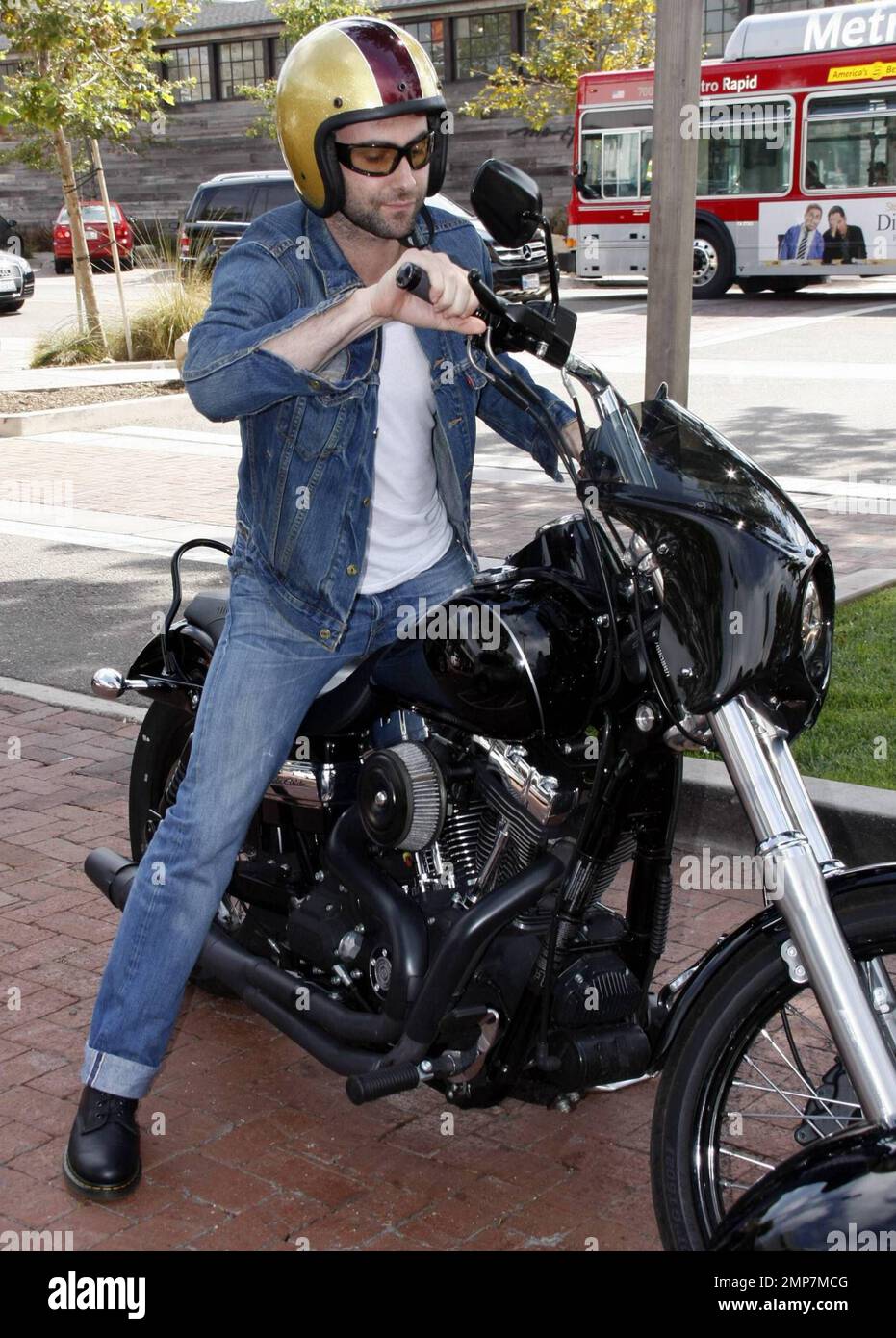 Maroon 5 singer Adam Levine arrives at Café Habana on his motorcycle ...
