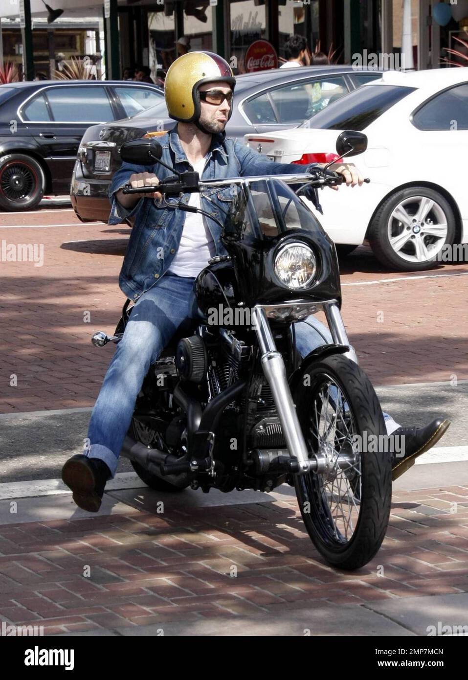 Maroon 5 singer Adam Levine arrives at Café Habana on his motorcycle ...