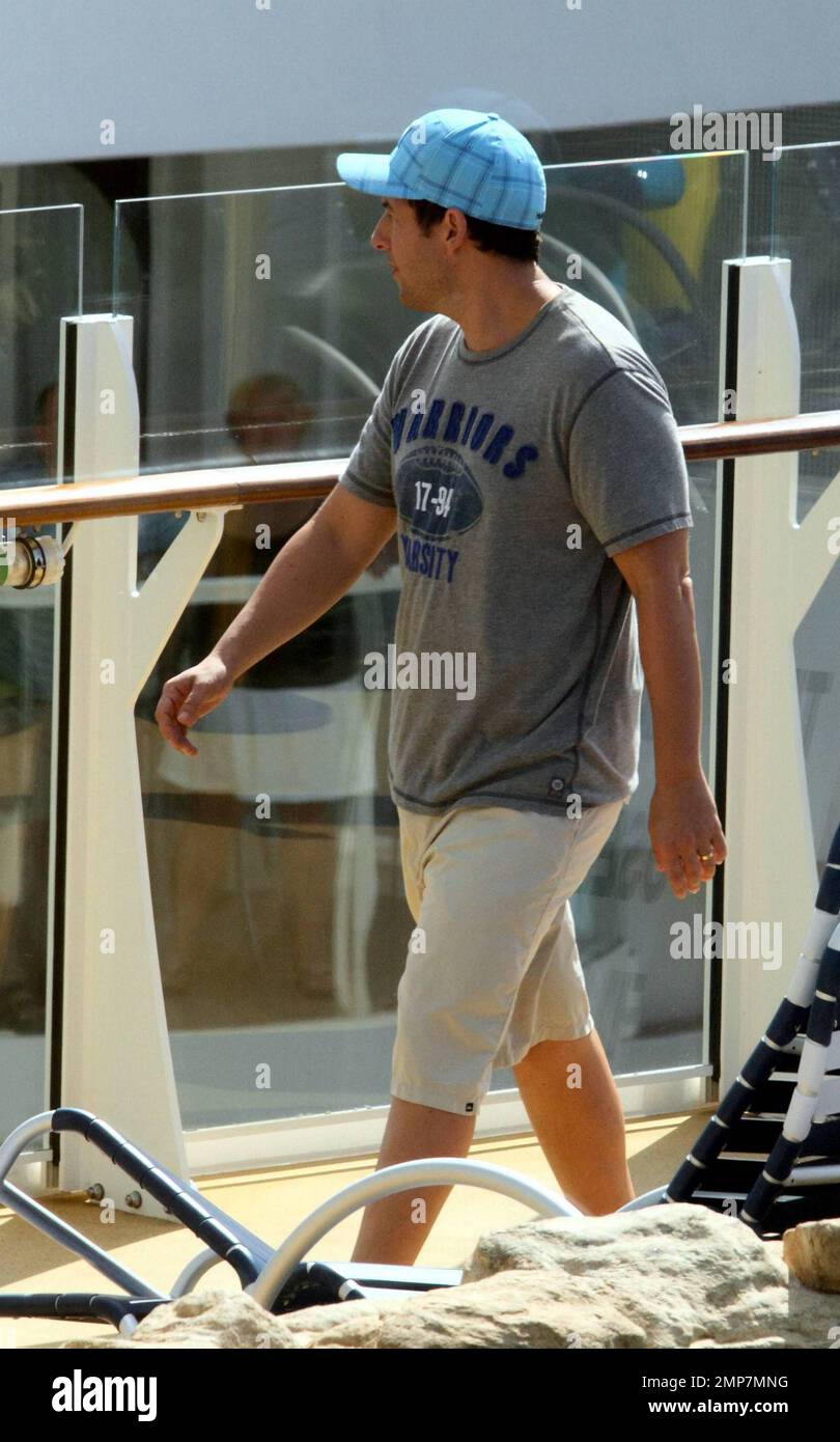 Actor Adam Sandler strolls during some downtime from filming on Royal ...
