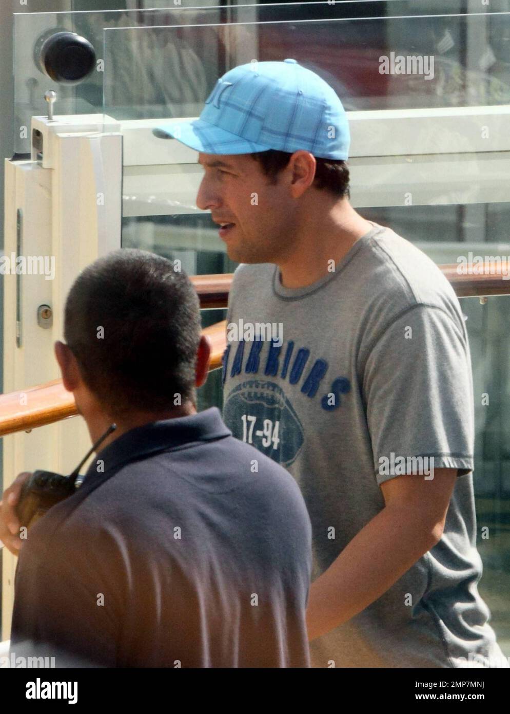 Actor Adam Sandler strolls during some downtime from filming on Royal ...