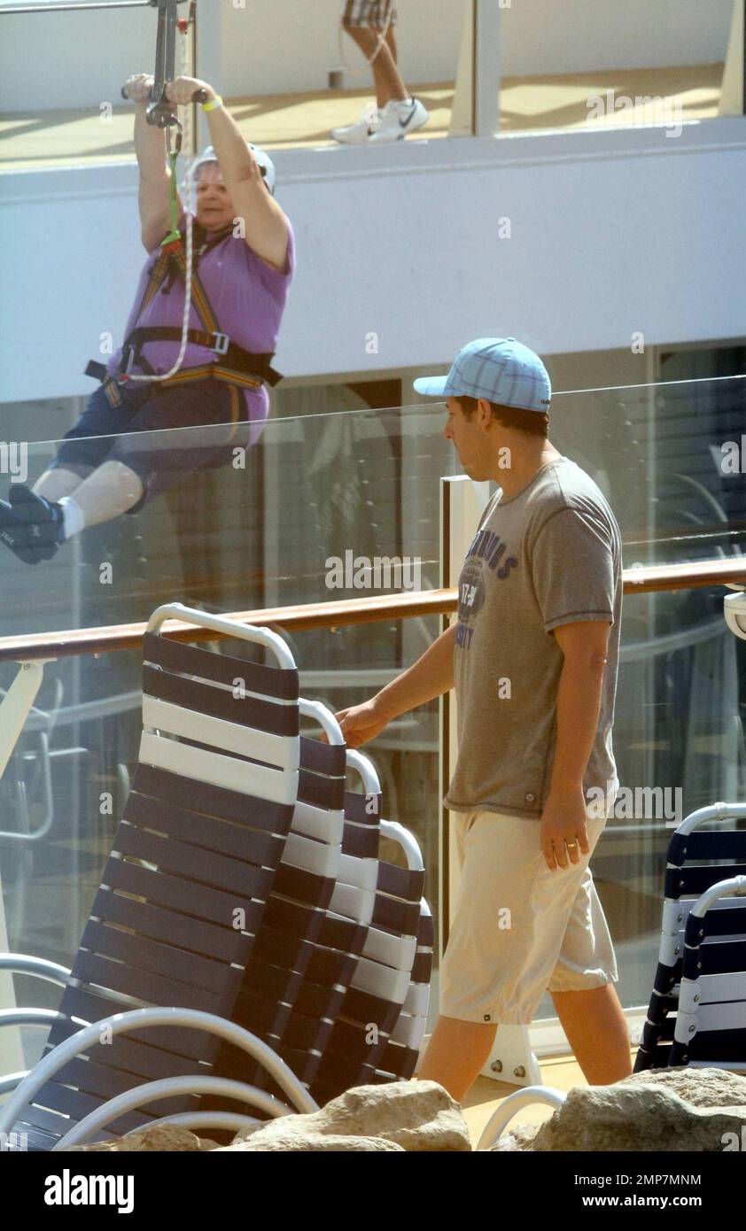 Actor Adam Sandler strolls during some downtime from filming on Royal ...