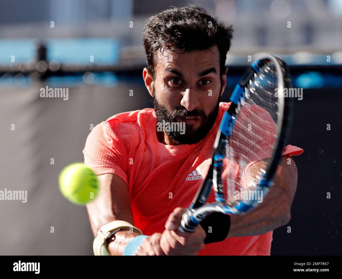 India's Yuki Bhambri makes a backhand return to Marcos Baghdatis of ...