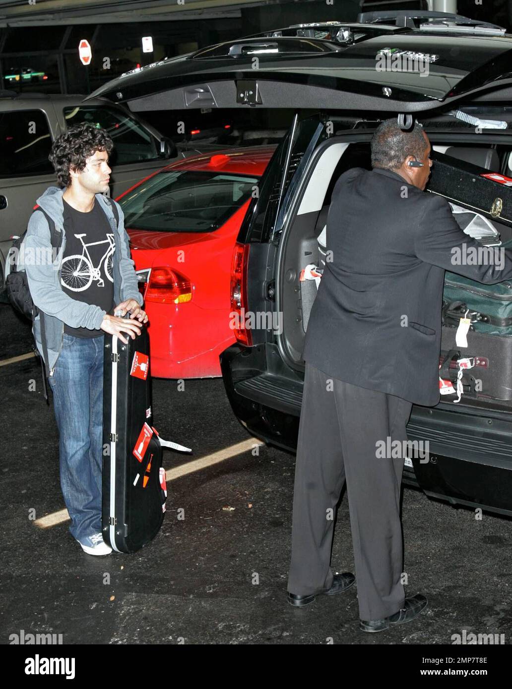Adrian Grenier arrives at Miami International Airport with his The ...