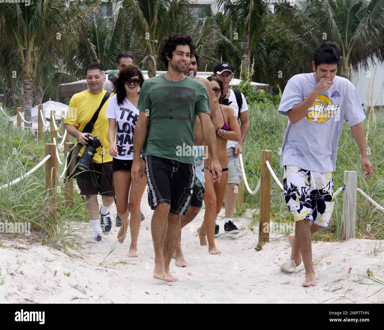 Adrian Grenier and his "entourage" lounge poolside. The actor is in ...