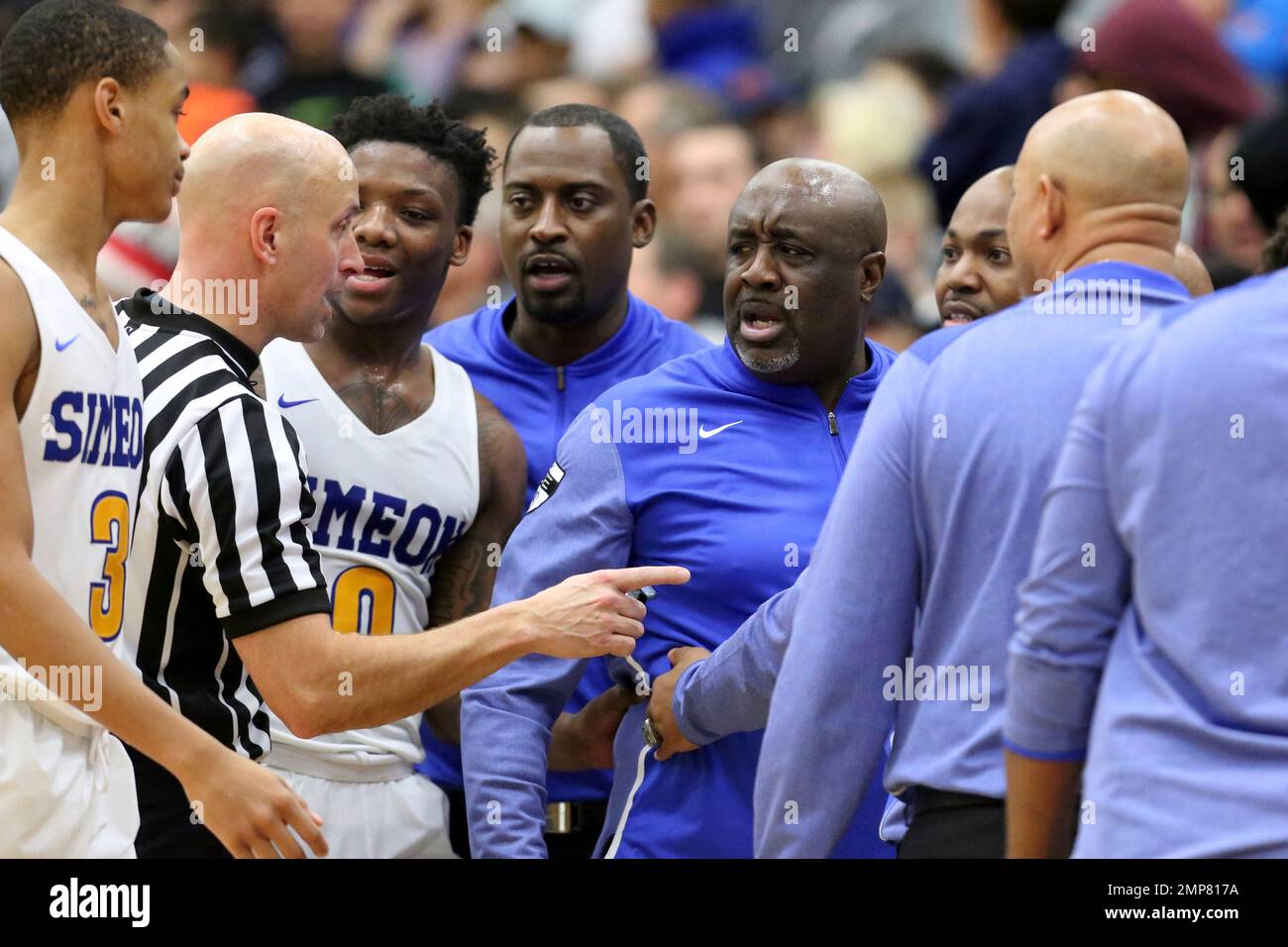 Simeon Career Academy's head coach Robert Smith argues with a referee ...