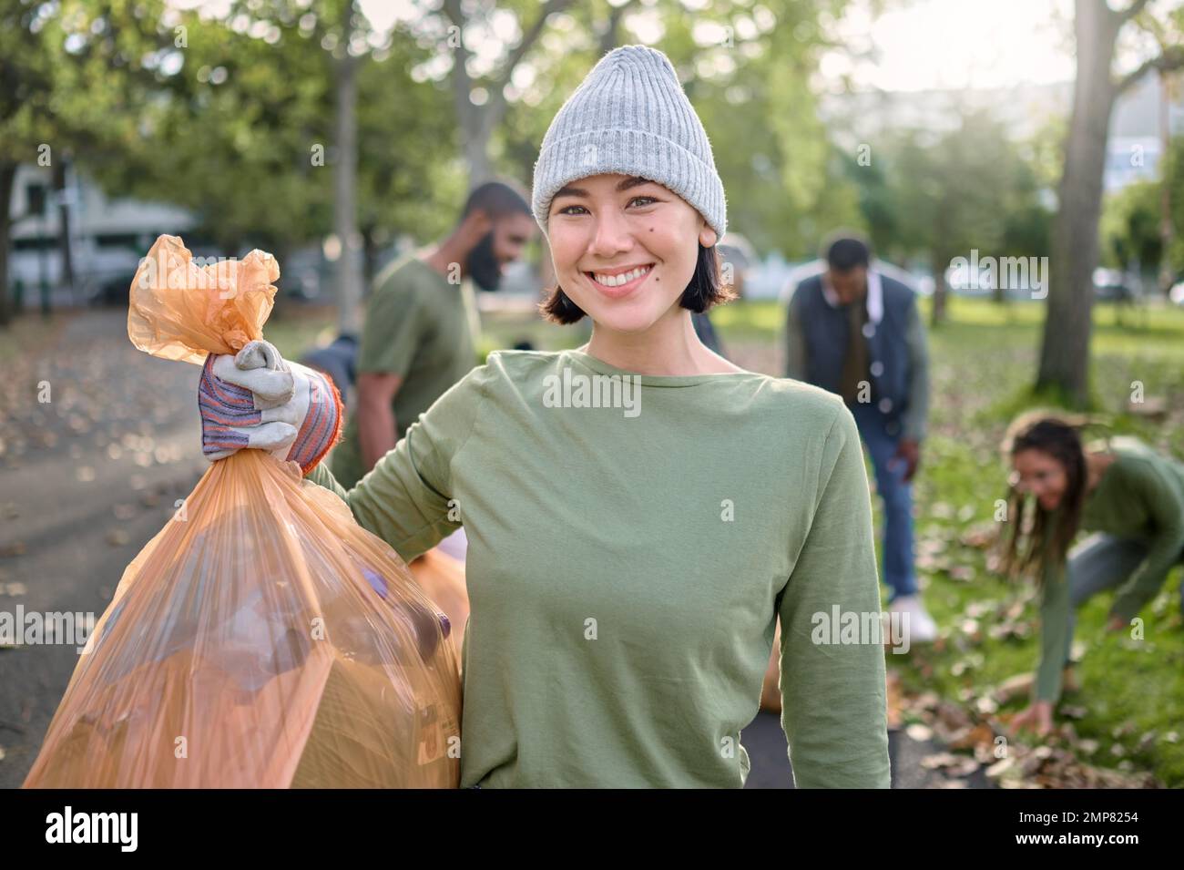 Park, plastic bag and woman in cleaning portrait for eco friendly ...