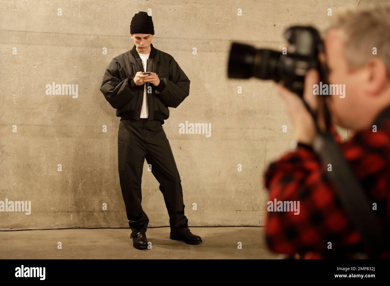 A model wears is photographed backstage prior to the Dirk Bikkembergs ...