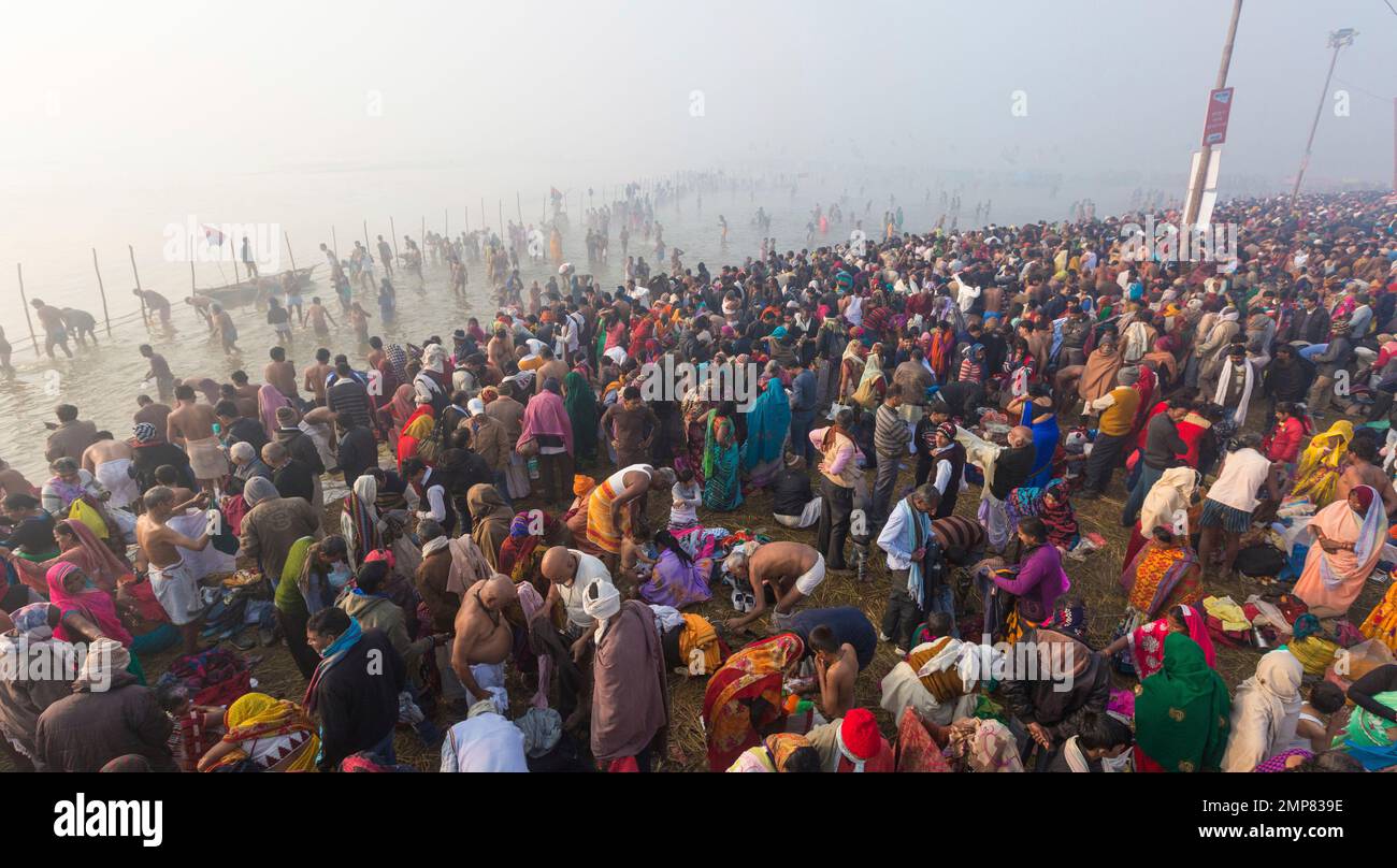 Hindu devotees crowd to take ritualistic dips in the Sangam, the confluence of the rivers Ganges ...