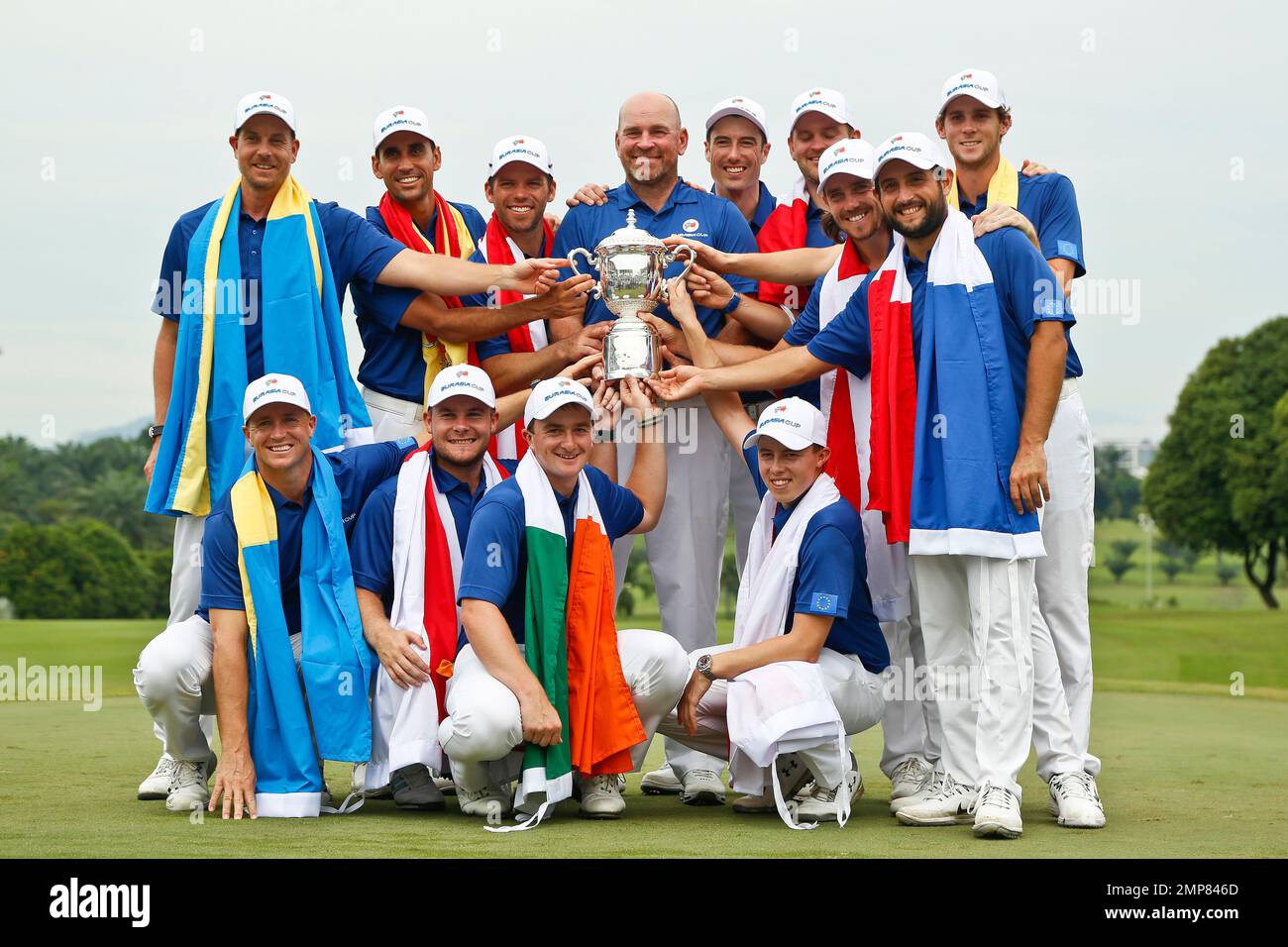 Team Europe captain Thomas Bjørn of Denmark, center, poses with his ...