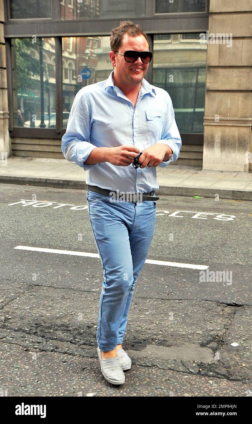 Radio and TV personality Alan Carr arrives at the BBC and poses for ...