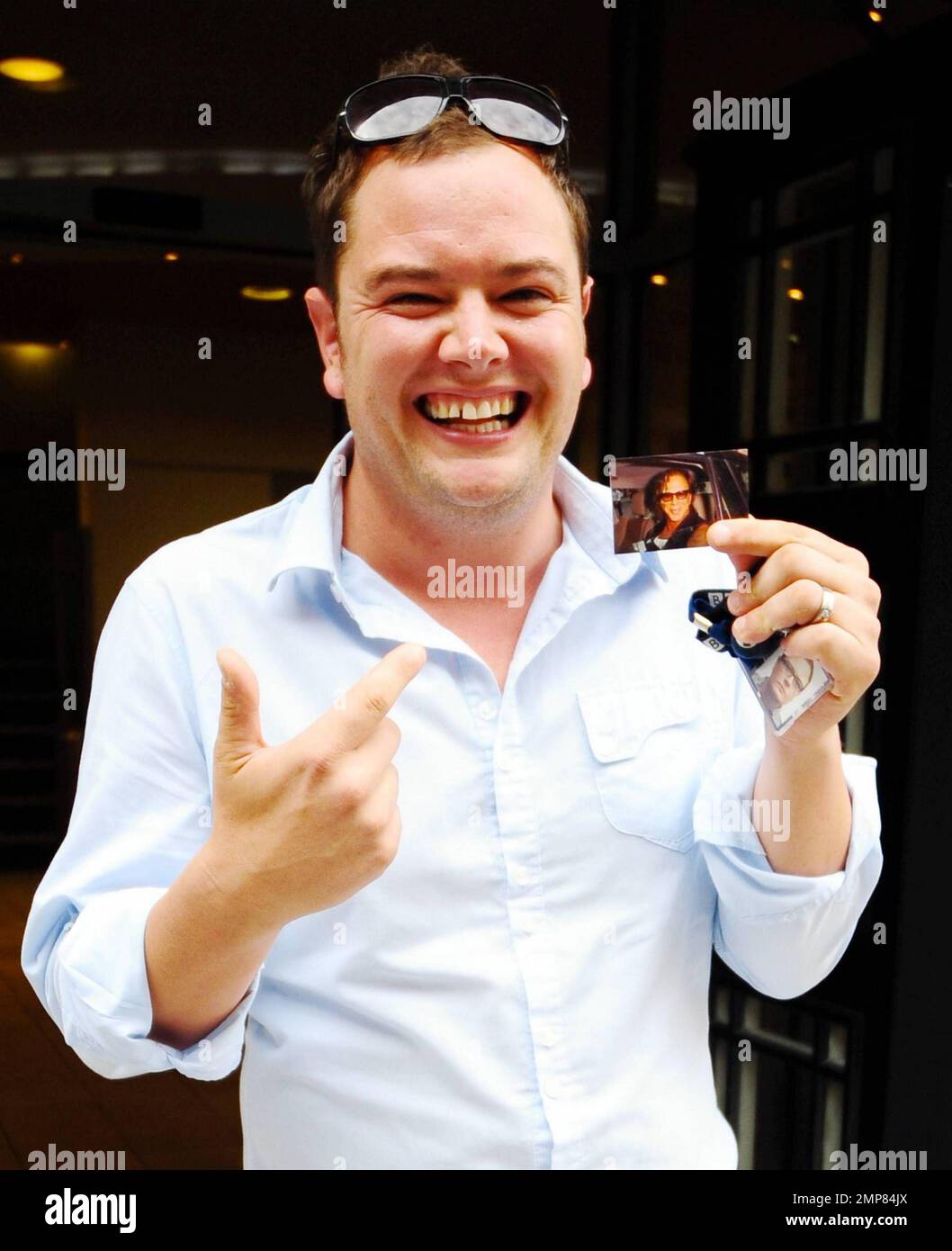 Radio and TV personality Alan Carr arrives at the BBC and poses for ...