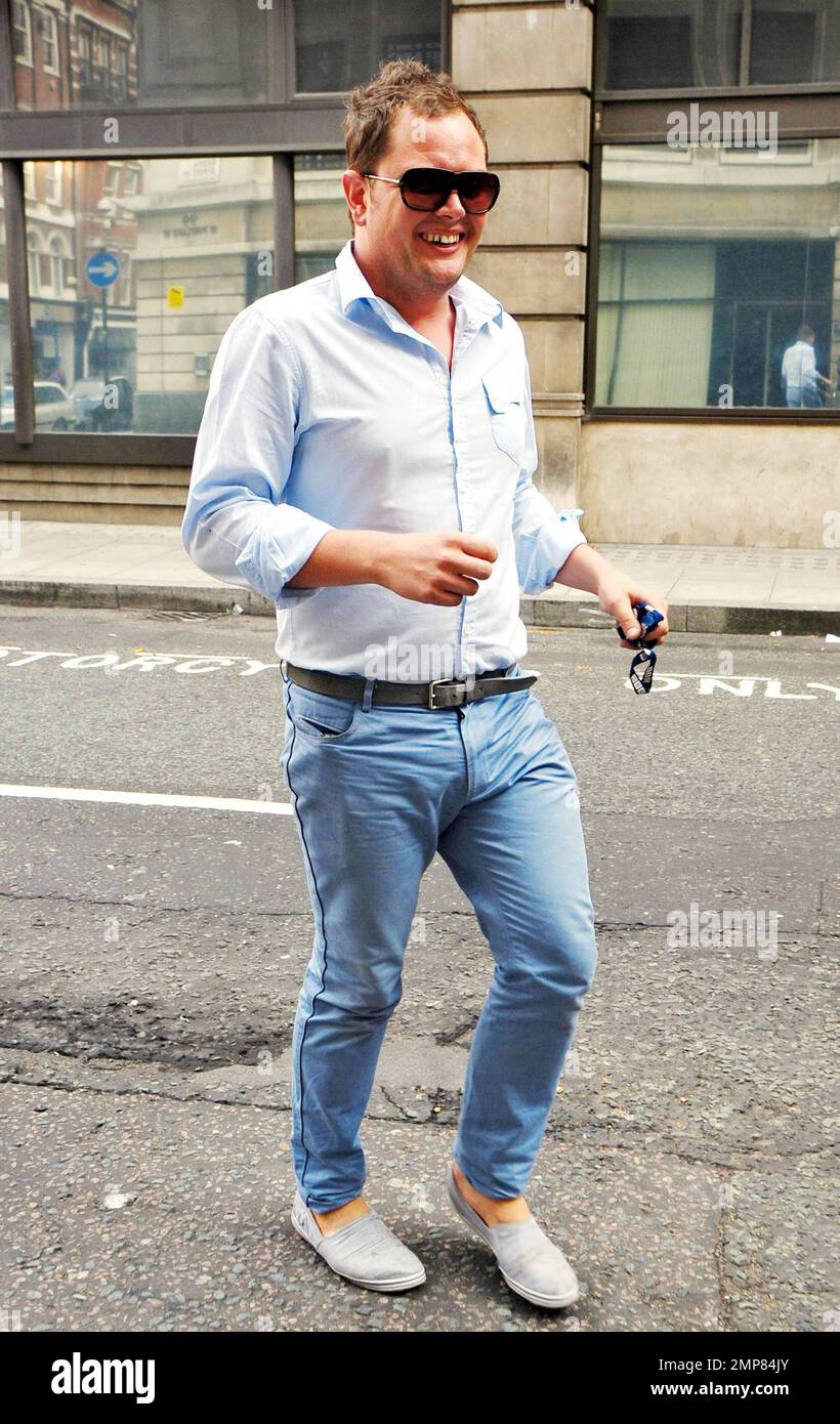 Radio and TV personality Alan Carr arrives at the BBC and poses for ...