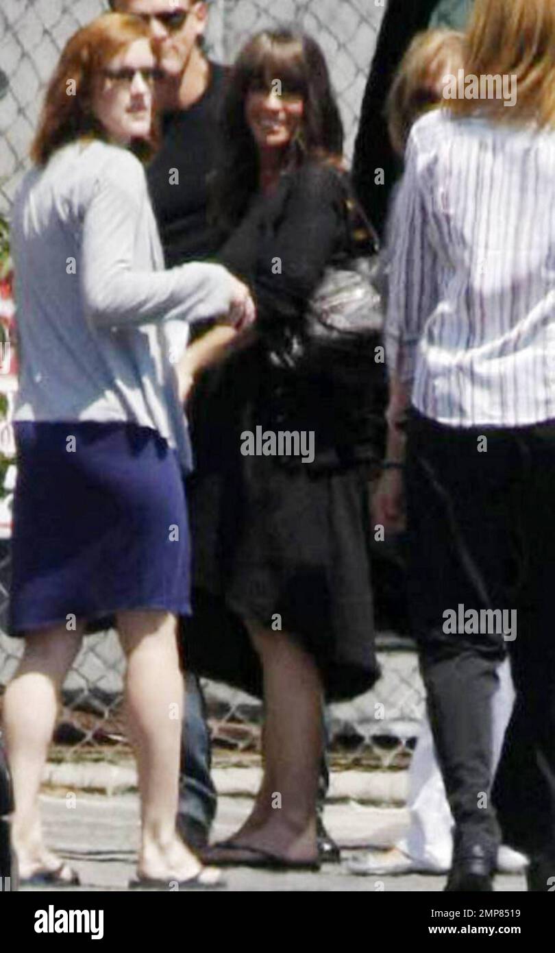Singer Alanis Morissette holds hands with her husband of four months ...