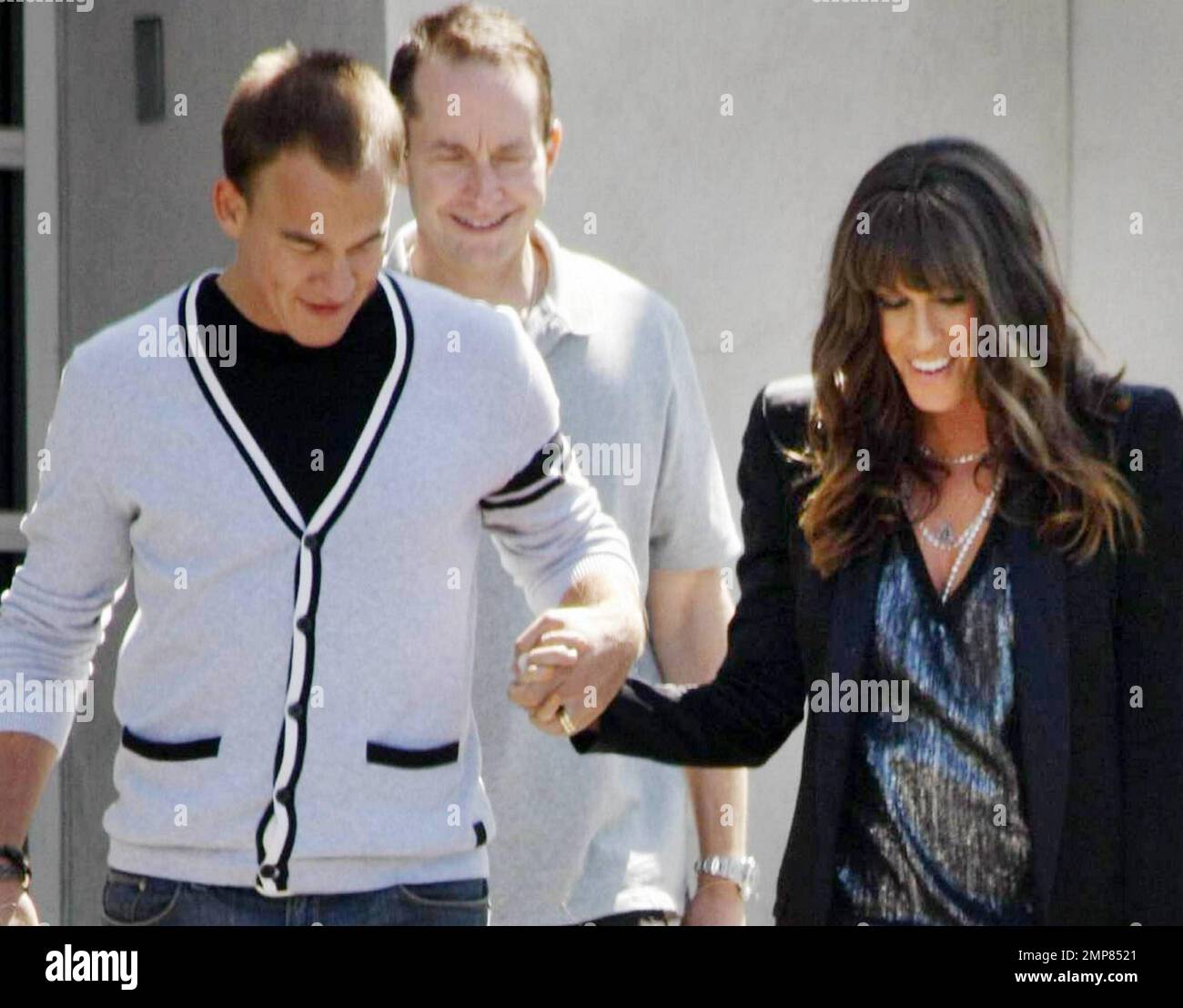 Singer Alanis Morissette holds hands with her husband of four months ...