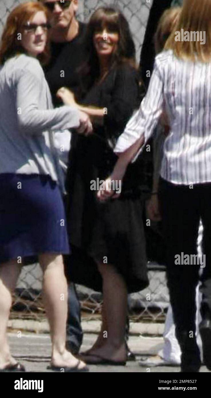 Singer Alanis Morissette holds hands with her husband of four months ...