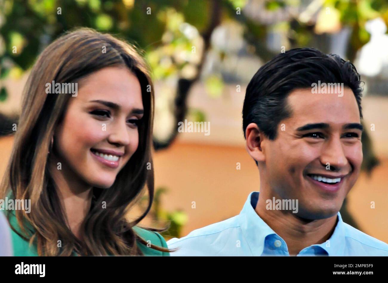Jessica Alba poses for photos with Mario Lopez during an interview at ...