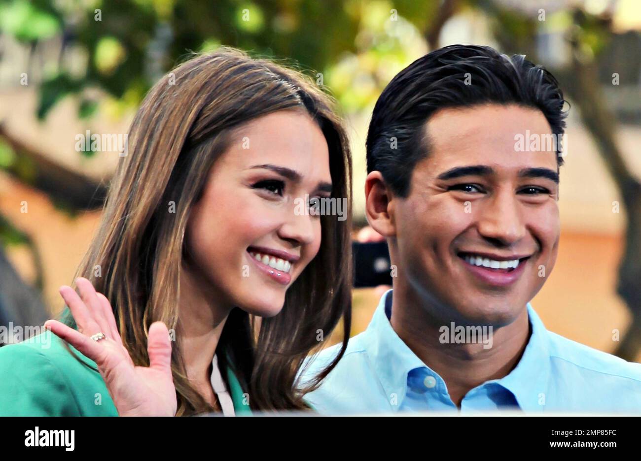 Jessica Alba poses for photos with Mario Lopez during an interview at ...