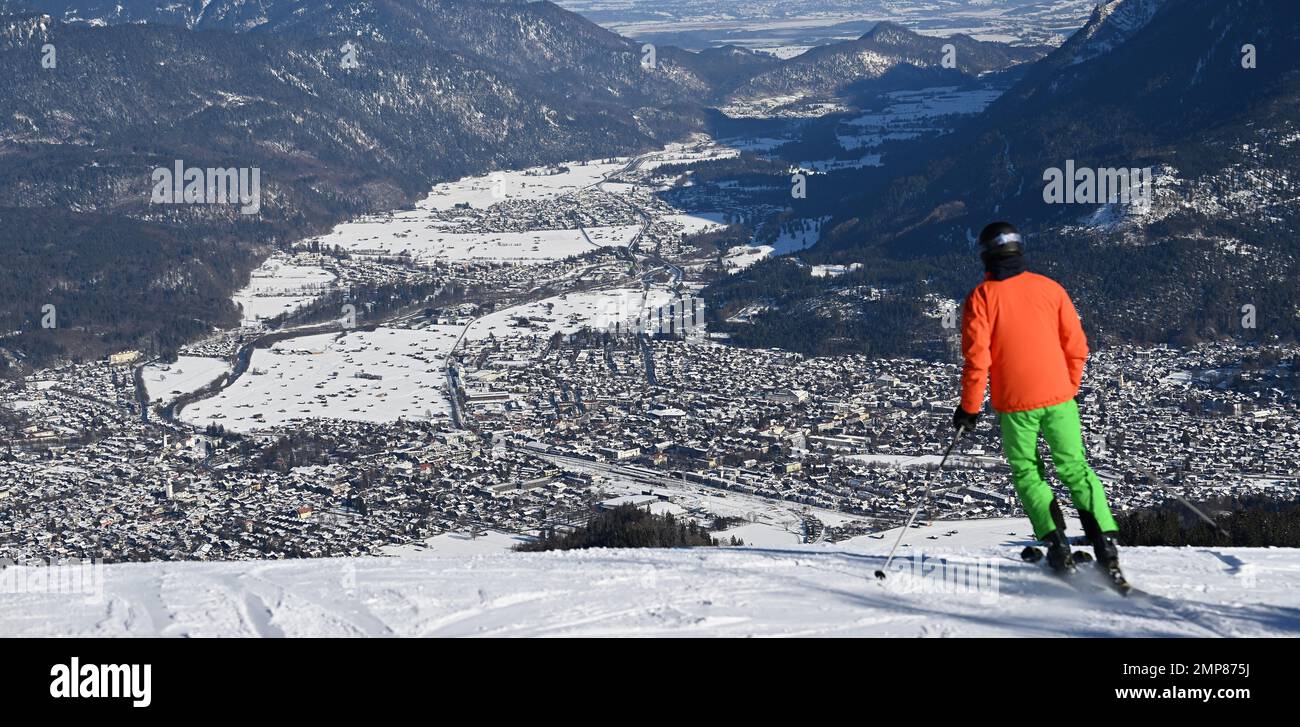 Garmisch Partenkirchen, Germany. 31st Jan, 2023. A skier looks down ...