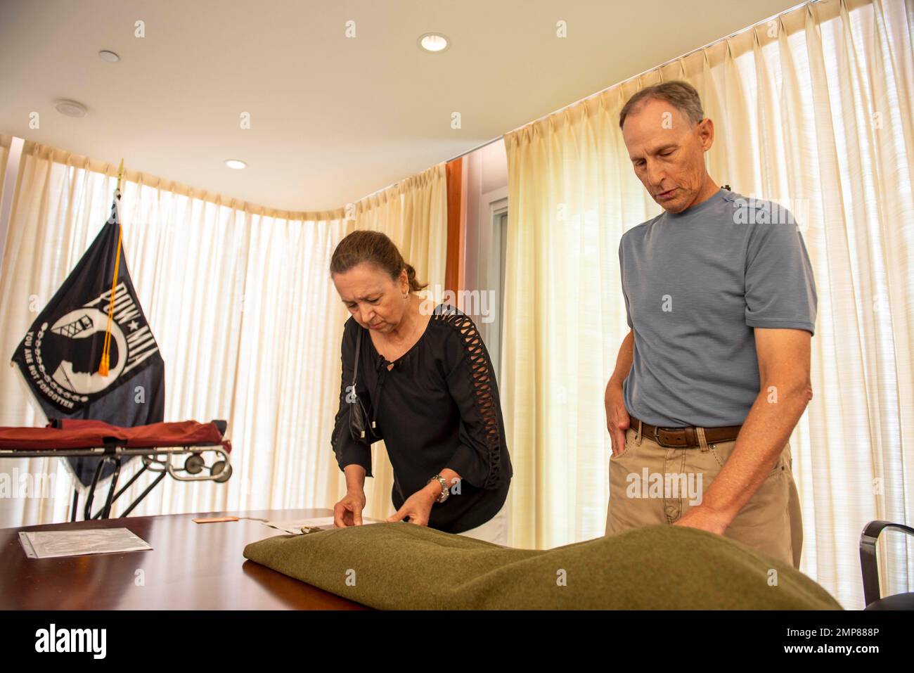 John Basden and his wife, Dolores Basden, secure the remains of his ...