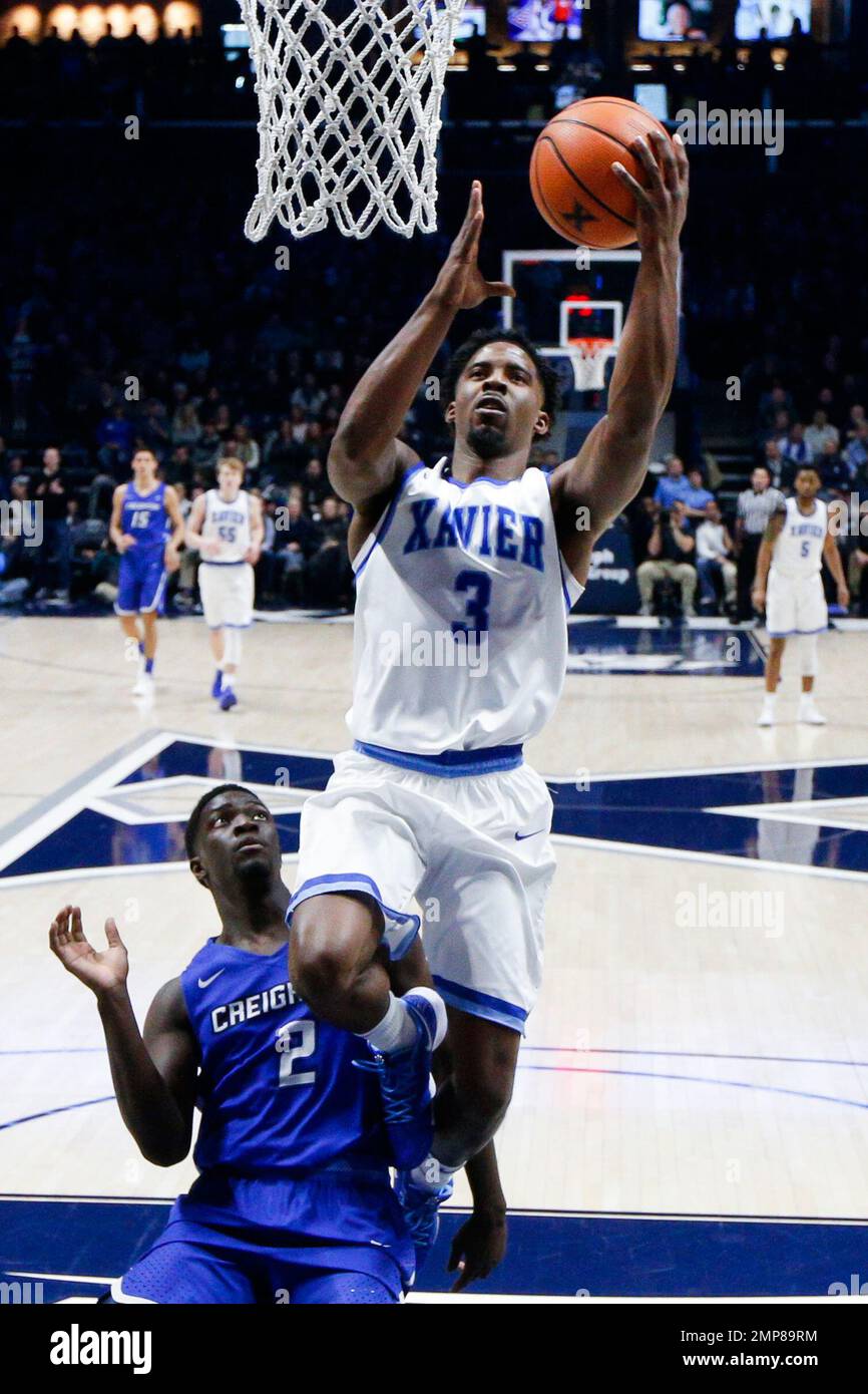 Xavier's Quentin Goodin (3) shoots over Creighton's Khyri Thomas (2) in ...