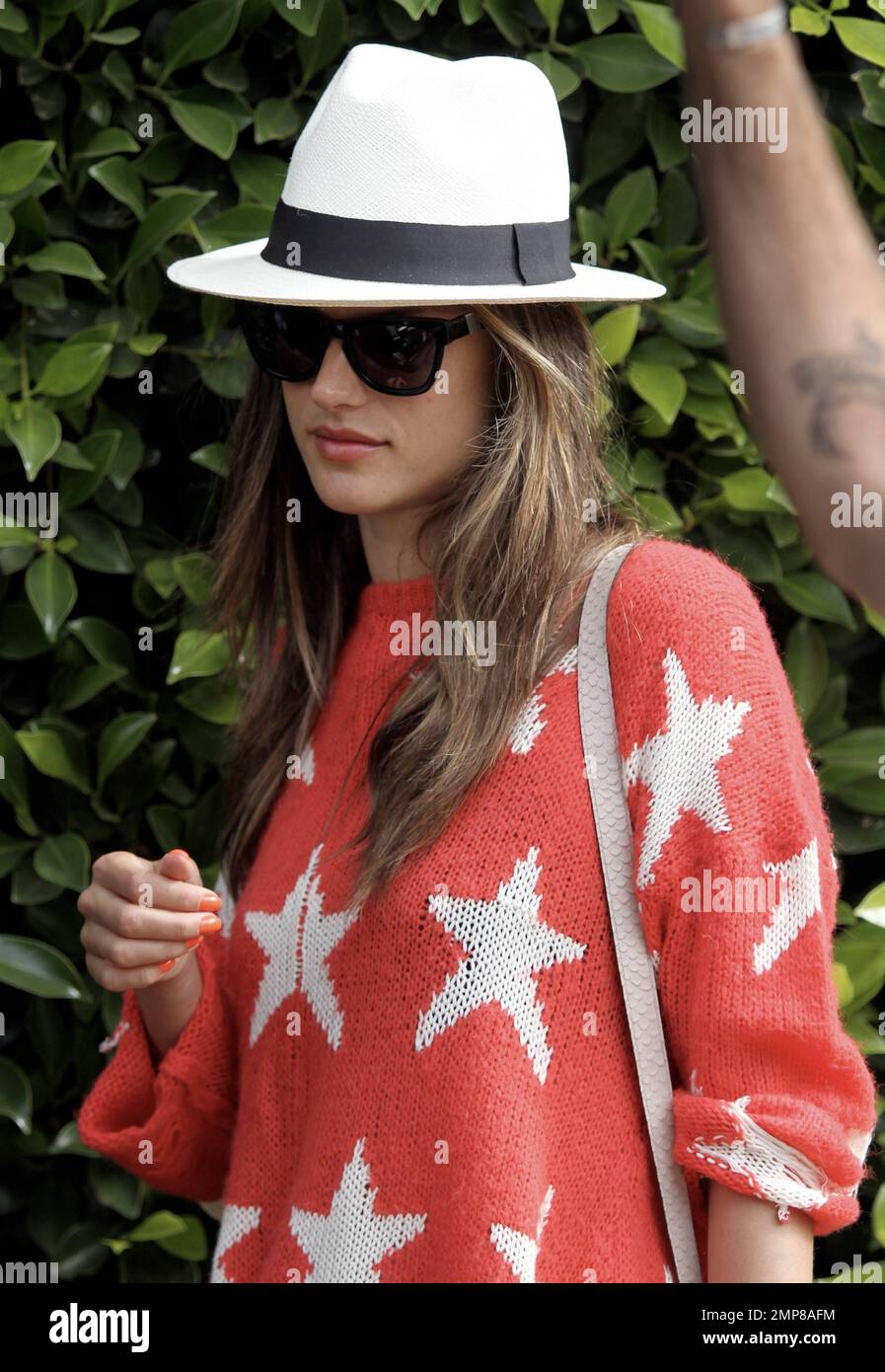 Supermodel Alessandra Ambrosio wears a star-patterned sweater as she ...