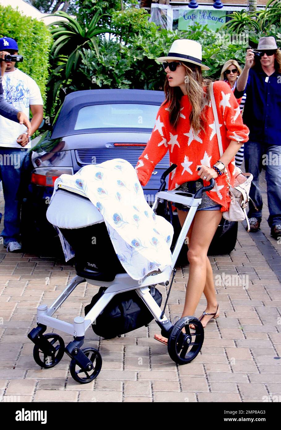 Supermodel Alessandra Ambrosio wears a star-patterned sweater as she ...