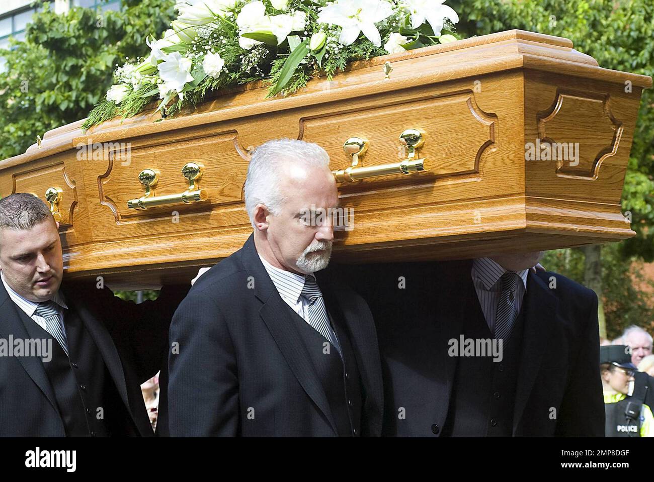 The body of snooker legend Alex "Hurricane" Higgins' is transported by ...