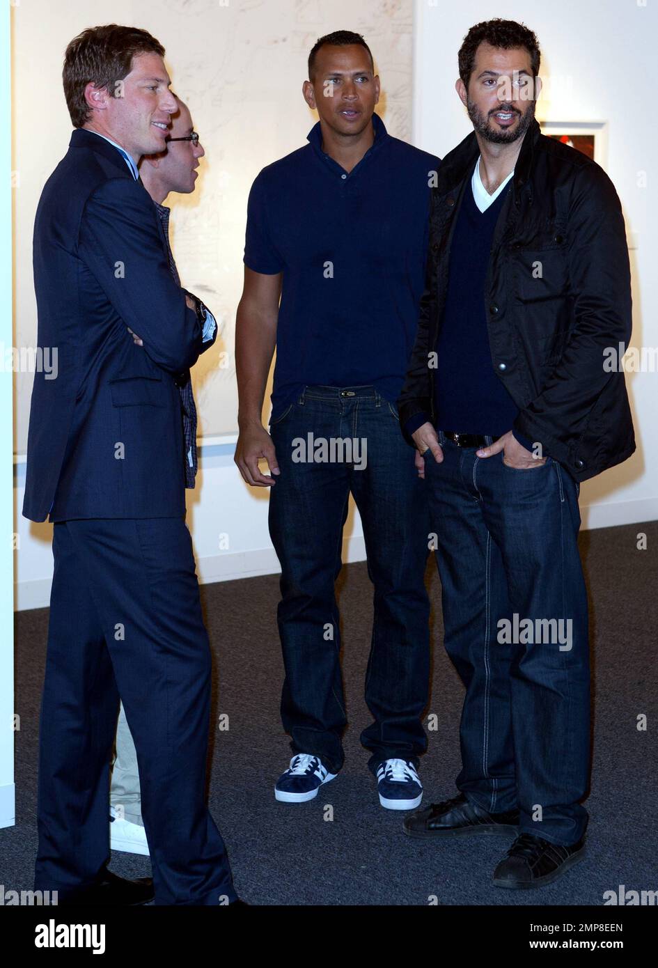 Alex Rodriguez chats with friends at an exhibition during day one of ...