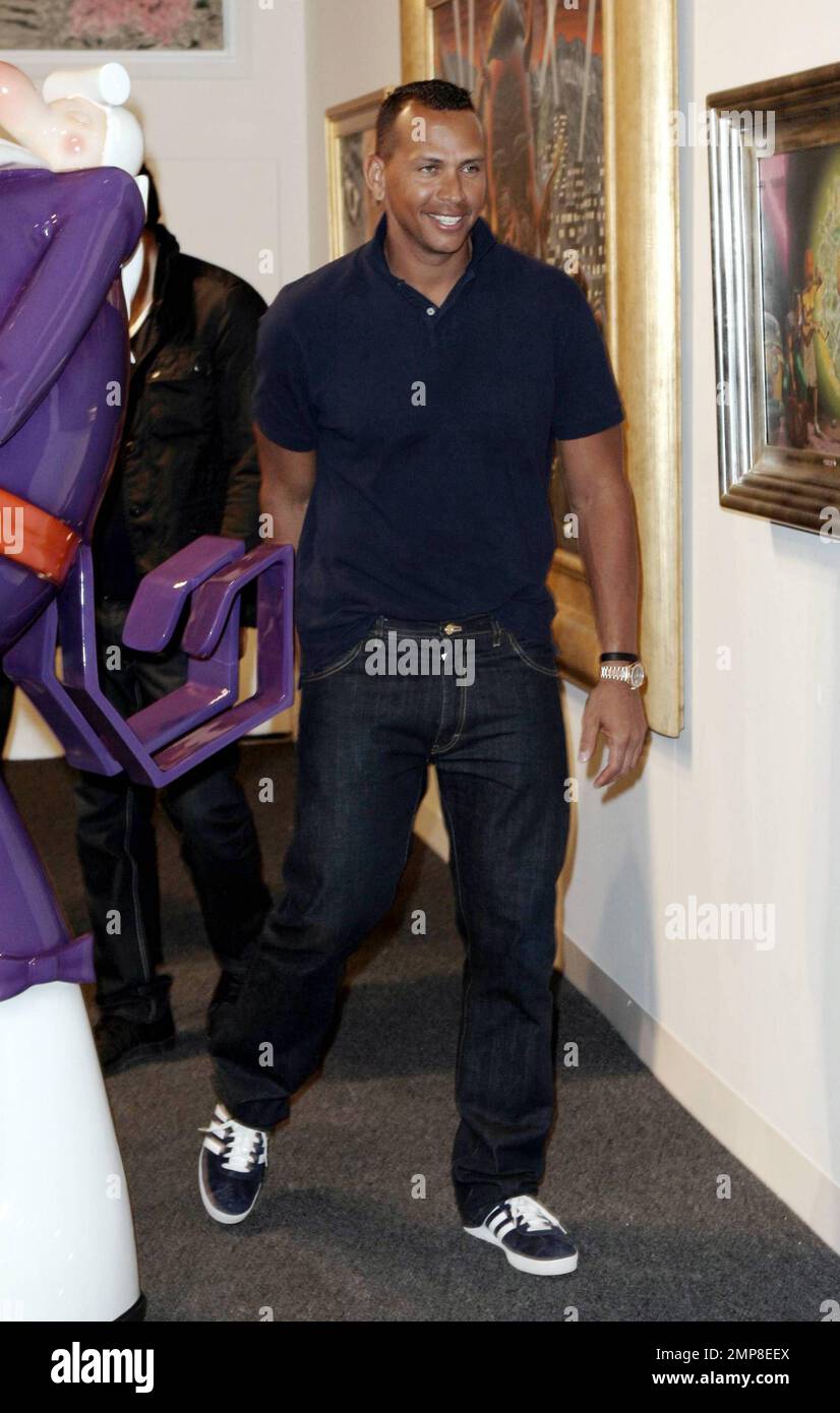 Alex Rodriguez chats with friends at an exhibition during day one of ...