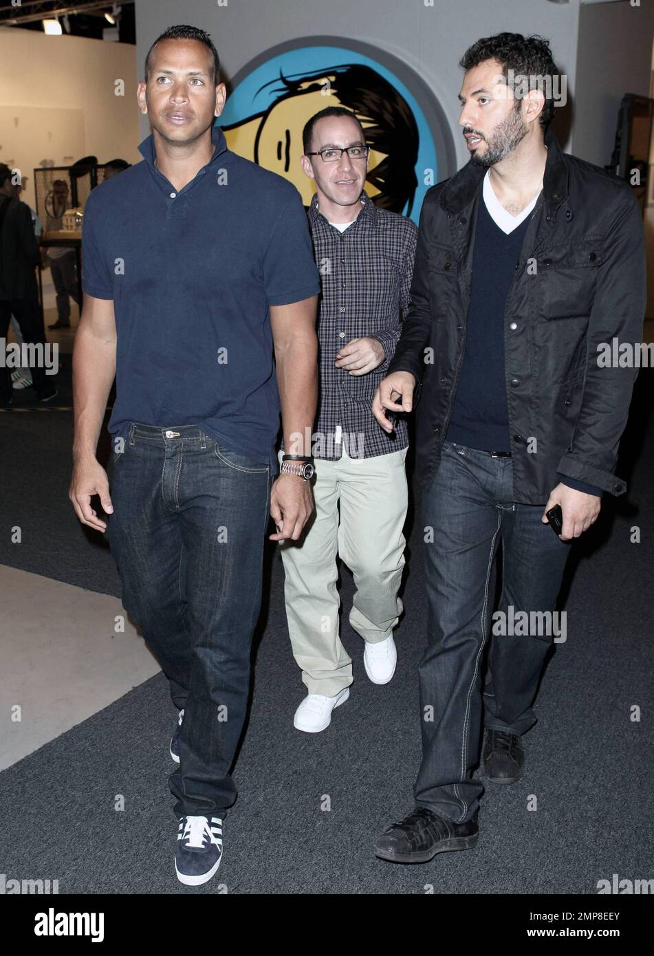 Alex Rodriguez chats with friends at an exhibition during day one of ...