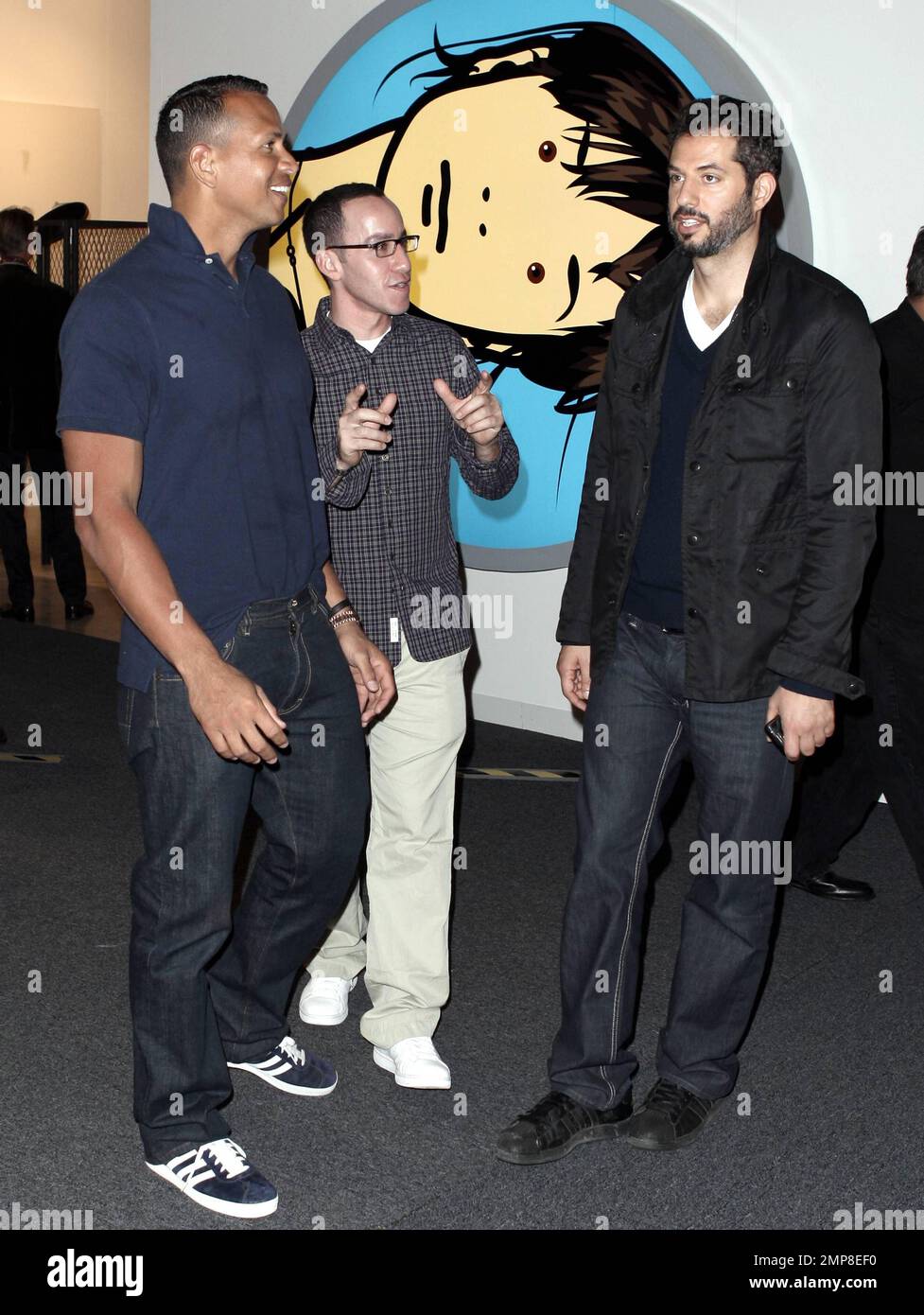 Alex Rodriguez chats with friends at an exhibition during day one of ...