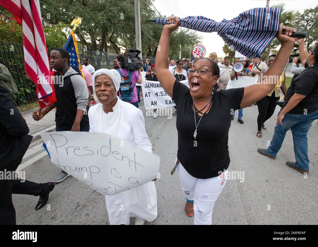 Haitian-Americans Jocelyne Pierre, left, and Yanick Gorneo, right ...
