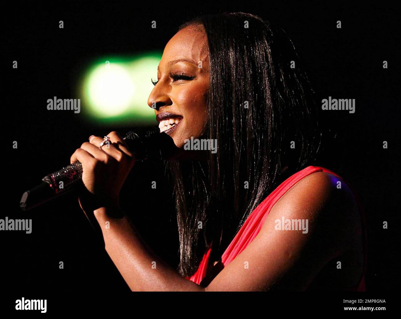 In a tight pink mini dress and studded ankle boots Alexandra Burke of X ...