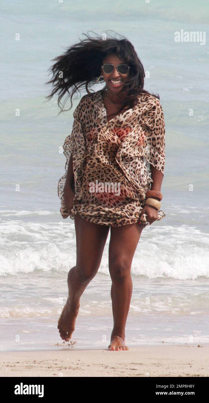 UK Singer Alexandra Burke takes a walk in the ocean during an afternoon ...