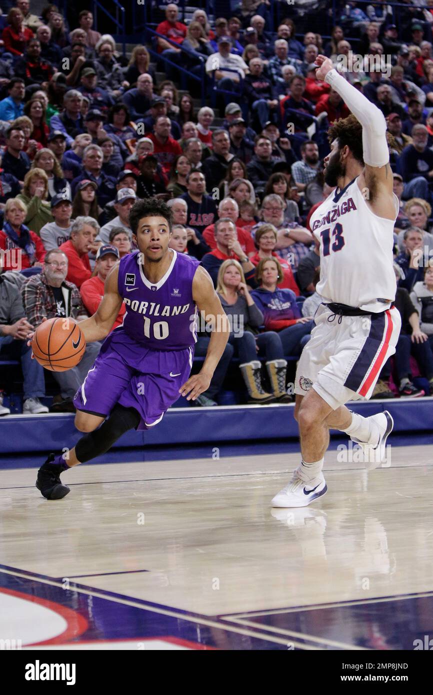 Portland guard Marcus Shaver Jr. (10) drives to the basket while ...