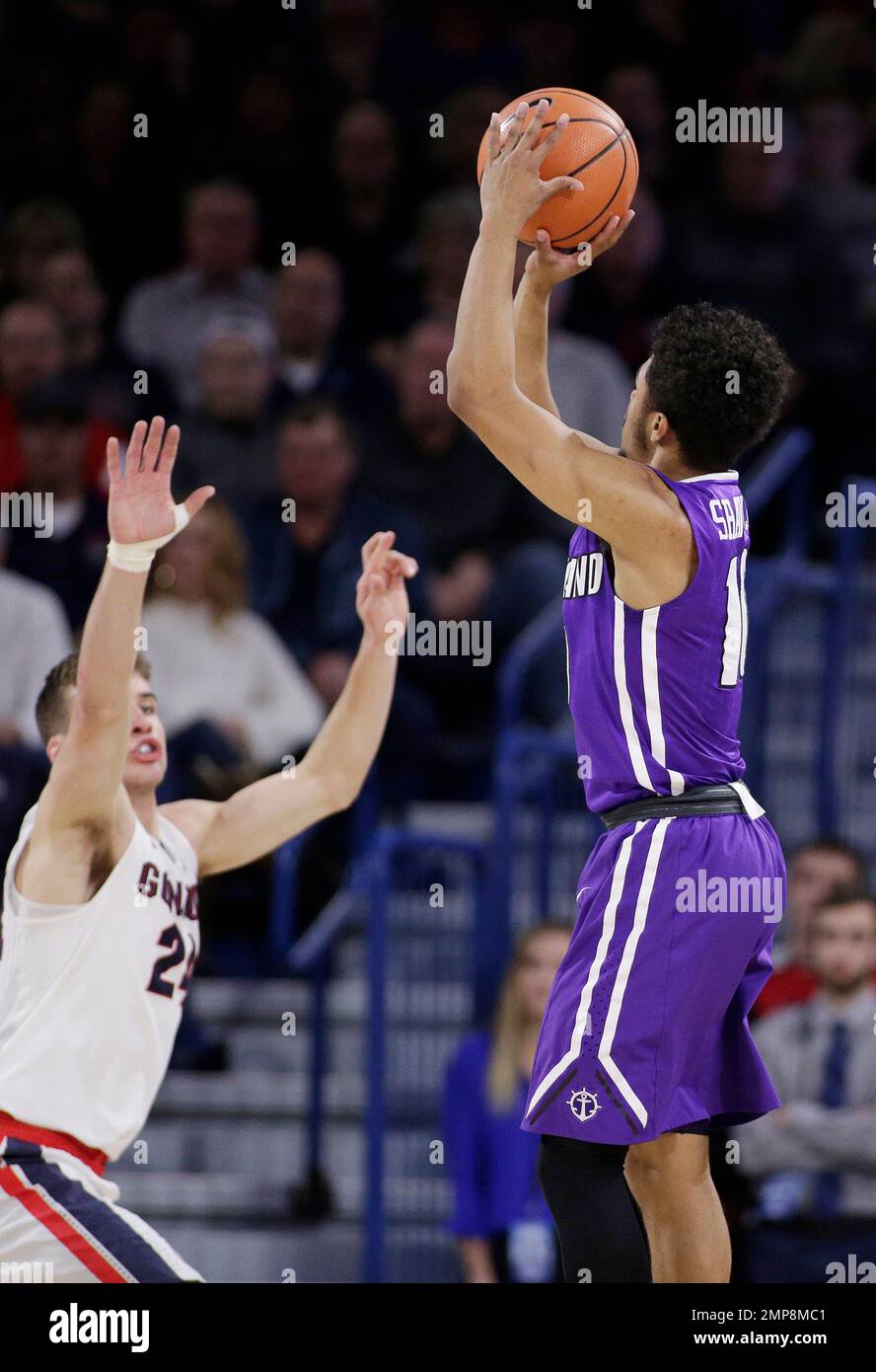 Portland guard Marcus Shaver Jr., right, shoots against Gonzaga forward ...