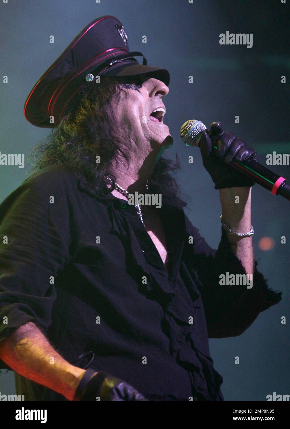 Alice Cooper stays true to his dark style as he rocks out in tight ...