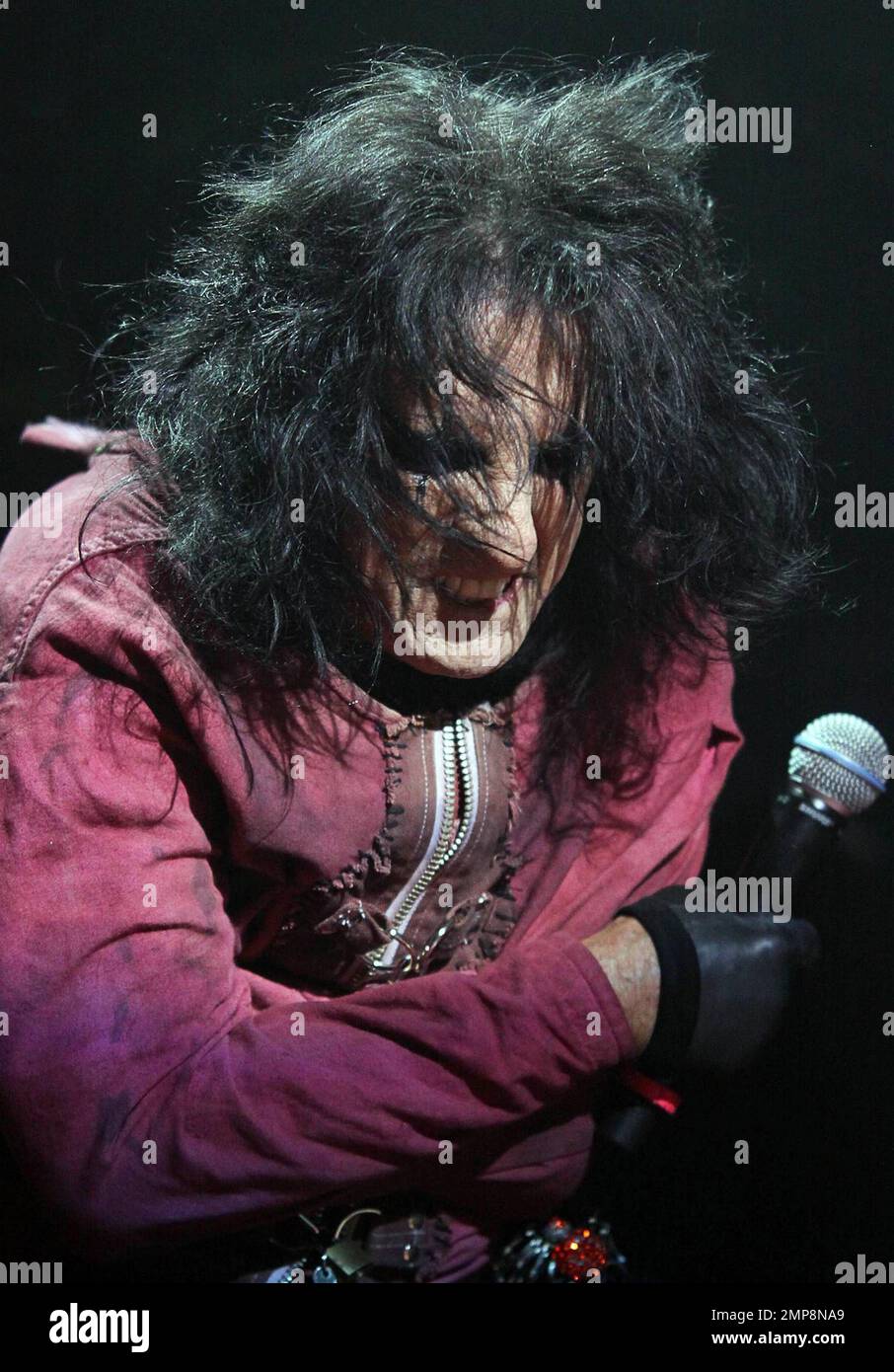 Alice Cooper stays true to his dark style as he rocks out in tight ...