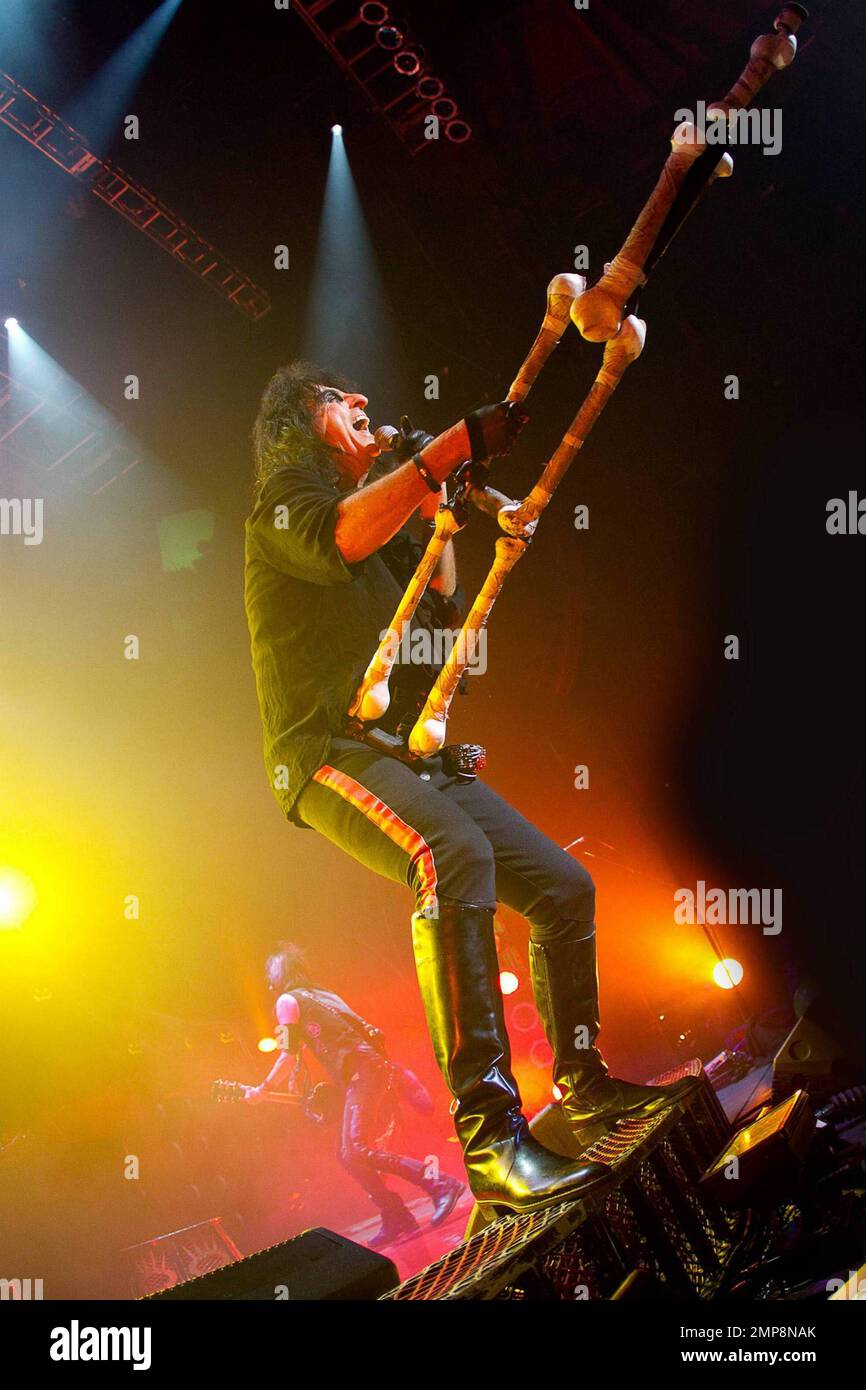 Alice Cooper stays true to his dark style as he rocks out in tight ...