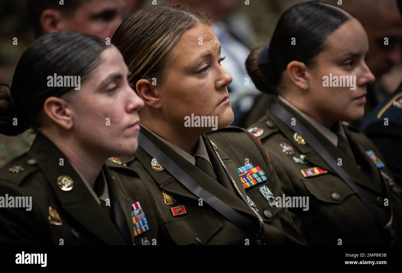 A group of Soldiers listen to members of the Sergeant Major of The Army ...