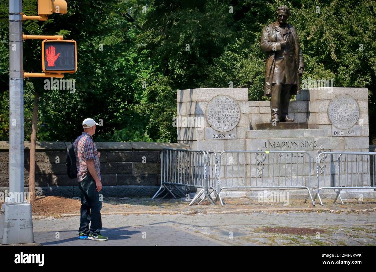 FILE- In this Aug. 22, 2017 file photo, a man looks at the Central Park ...