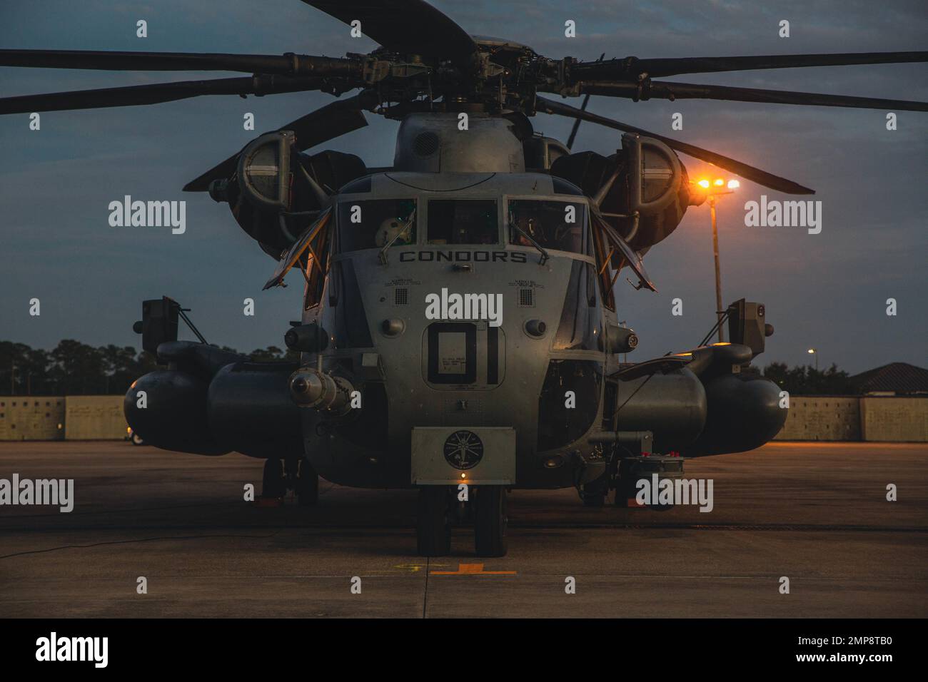 U.S. Marines with Marine Heavy Helicopter Squadron (HMH) 464 wait for ...