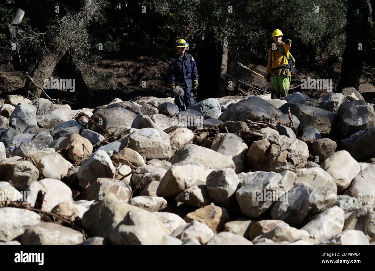 Emergency crew members work on storm damage in Montecito, Calif ...