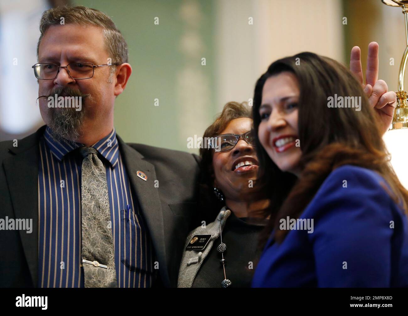 Colorado Senate President Kevin Grantham, R-Canon City, left, reaches ...