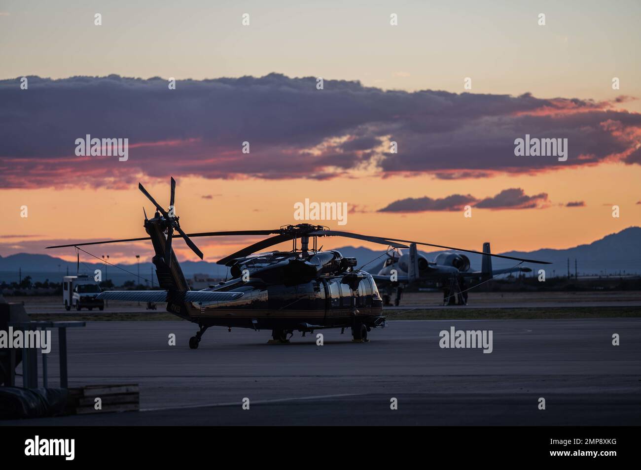 A U.S. Customs and Border Protection helicopter sits on the flightline ...