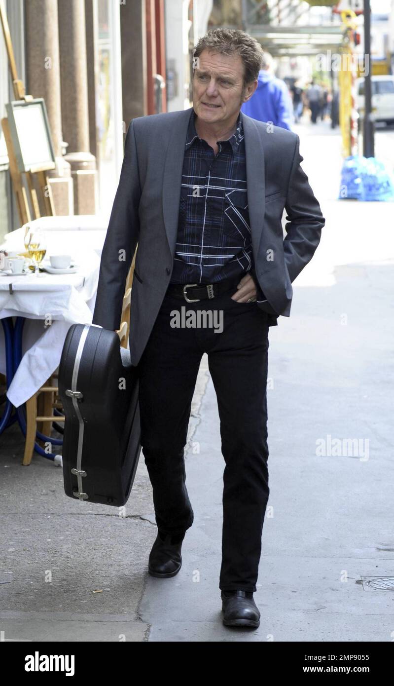 '70s pop icon Alvin Stardust (Shane Fenton) carries his guitar as he ...