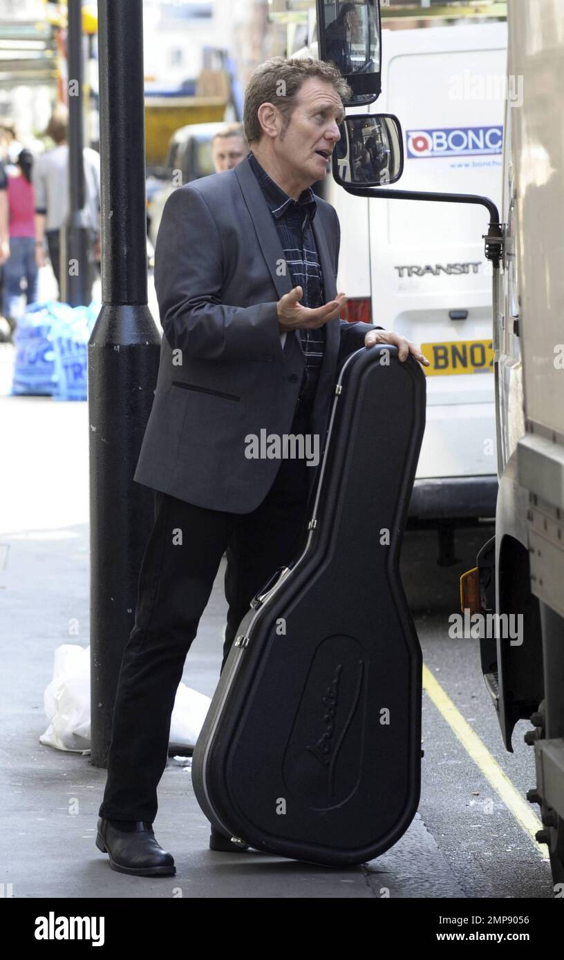 '70s pop icon Alvin Stardust (Shane Fenton) carries his guitar as he ...