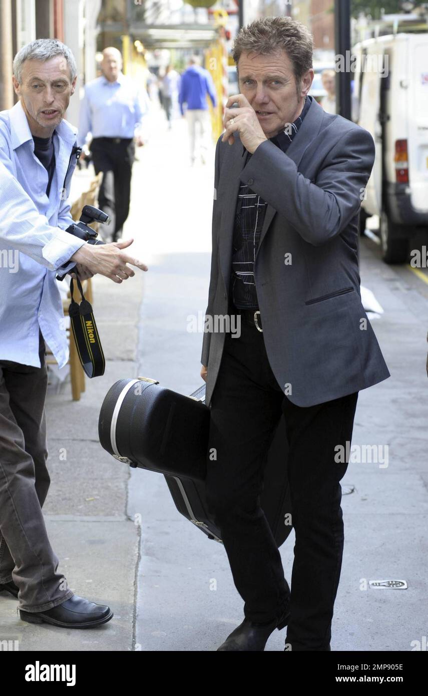 '70s pop icon Alvin Stardust (Shane Fenton) carries his guitar as he ...