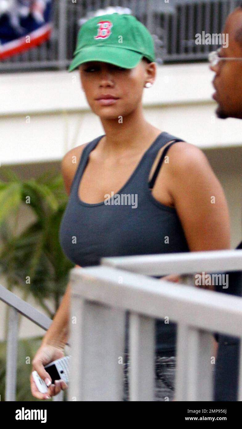 EXCLUSIVE!! Amber Rose wears a baseball cap and blue tank top with ...