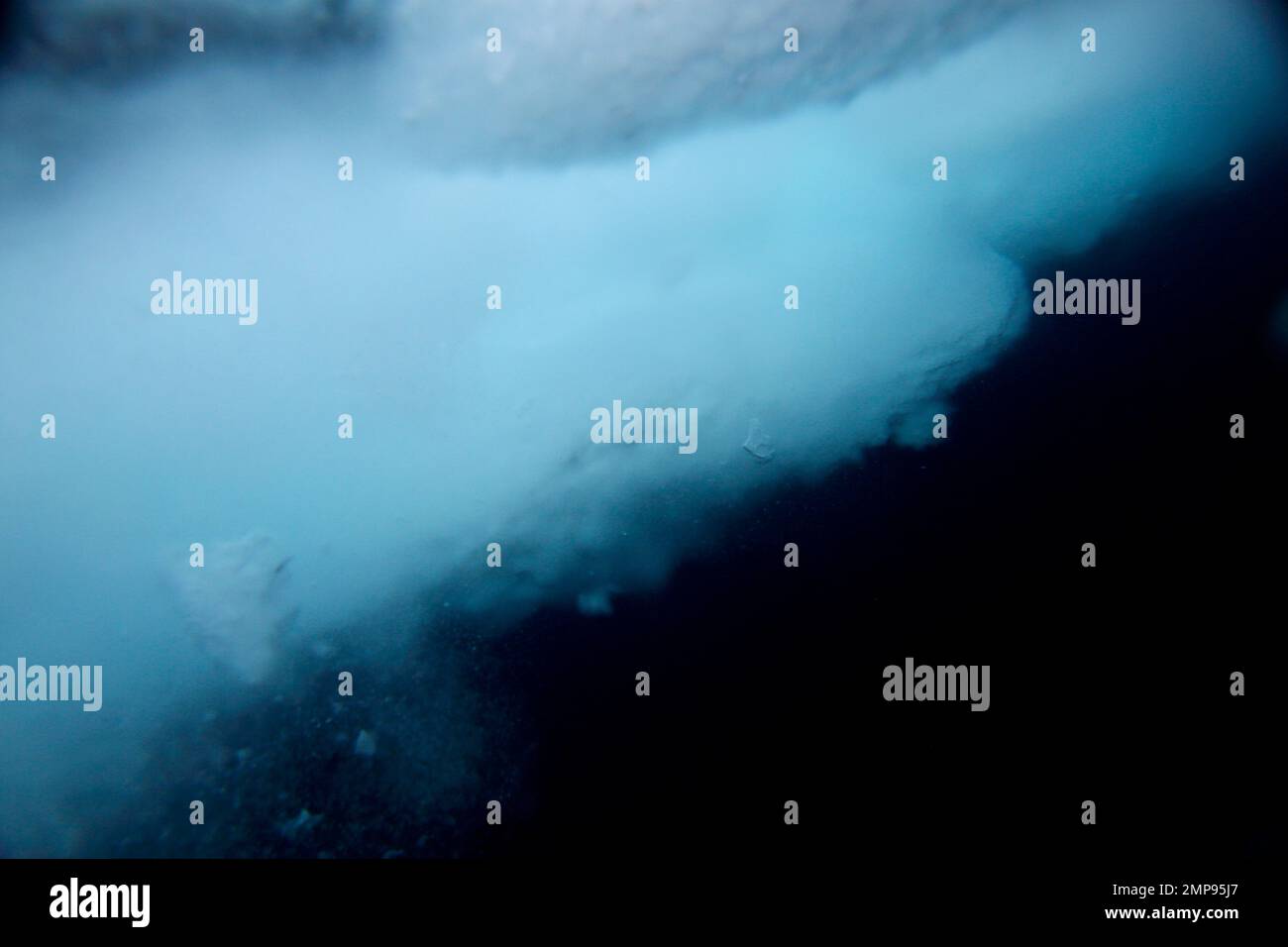 Sea ice is broken underwater by the hull of the Finnish icebreaker MSV ...
